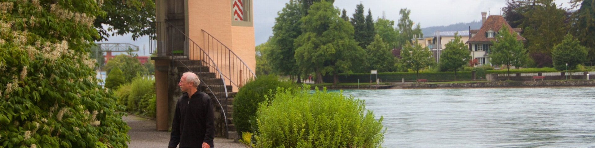 Schadaupark showing a lake or waterhole as well as an individual male