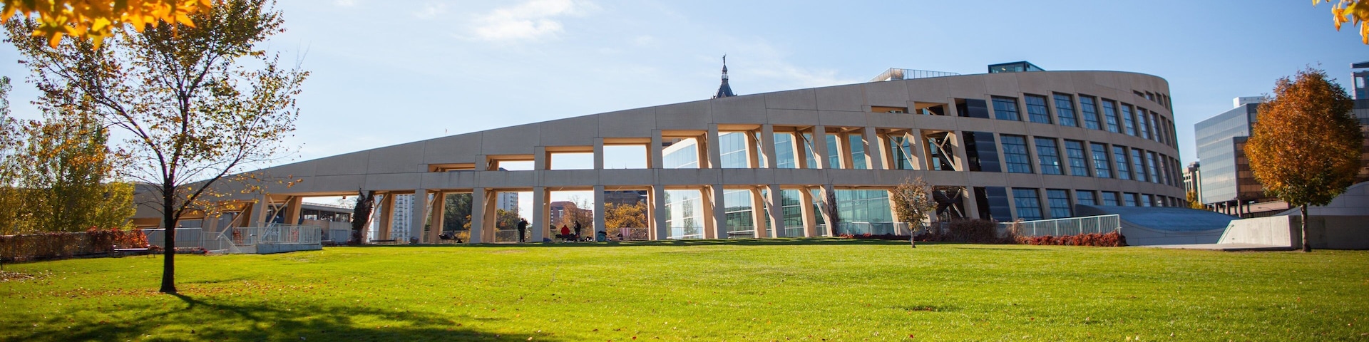 Salt Lake Public Library Main Building featuring modern architecture and a sunset