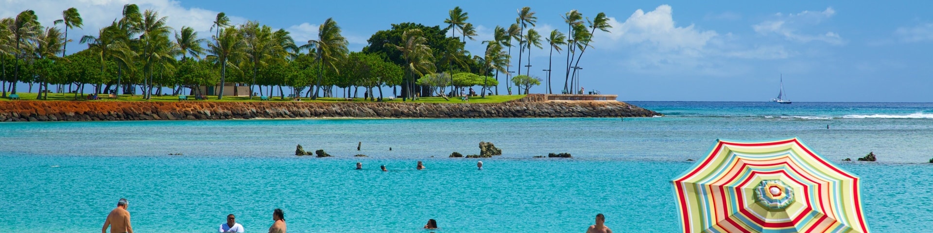 Ala Moana Beach Park featuring swimming, a sandy beach and tropical scenes