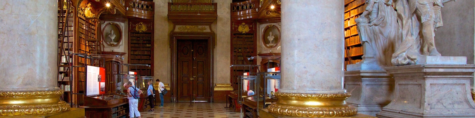 Austrian National Library showing an administrative buidling, interior views and a statue or sculpture