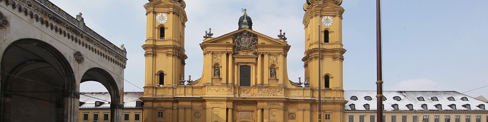 Odeonsplatz which includes a square or plaza, snow and heritage architecture