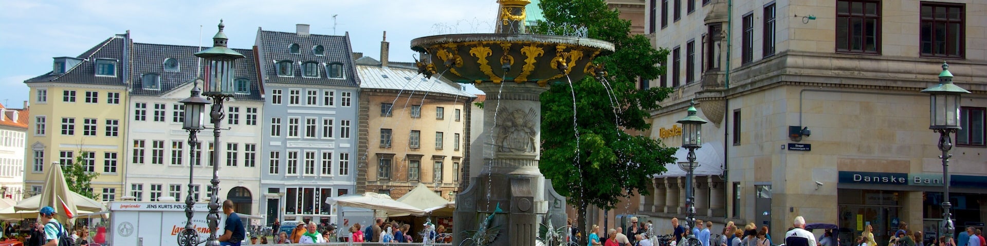 Caritas which includes a square or plaza, a fountain and a city