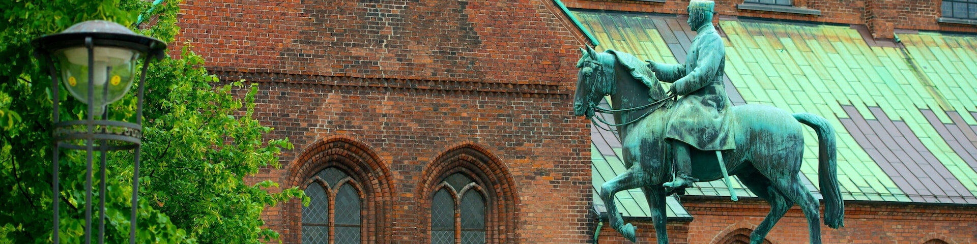 Church of Our Lady featuring a statue or sculpture, heritage elements and a church or cathedral
