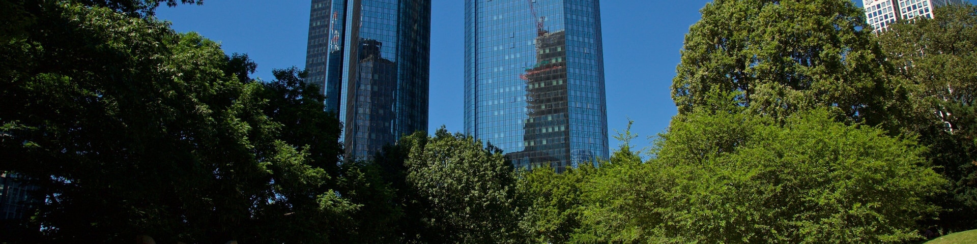 Deutsche Bank Twin Towers which includes a park and a high rise building