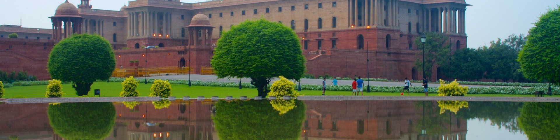 Presidential Palace featuring a pond and chateau or palace