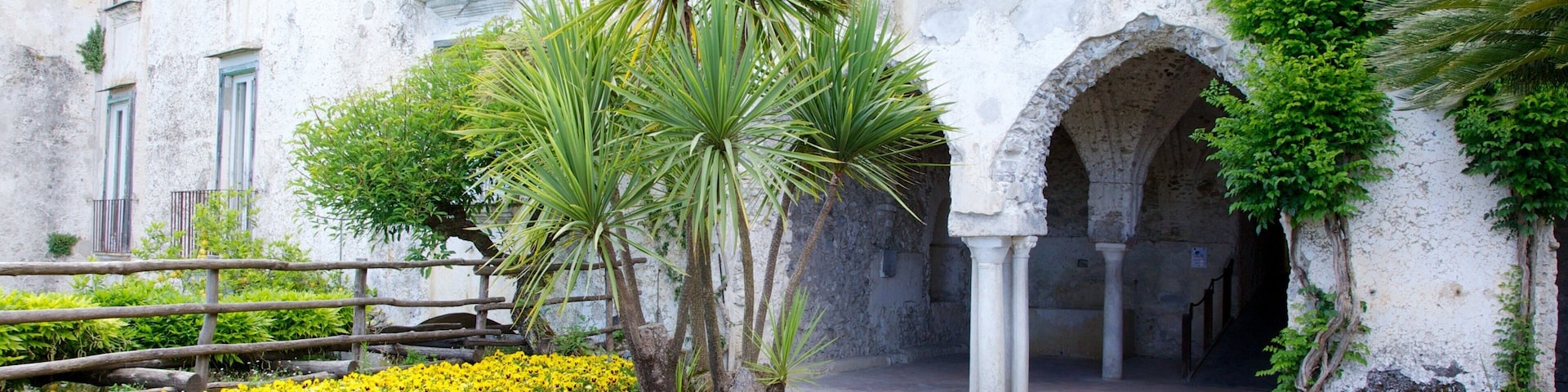 Villa Rufolo featuring flowers, a luxury hotel or resort and heritage architecture