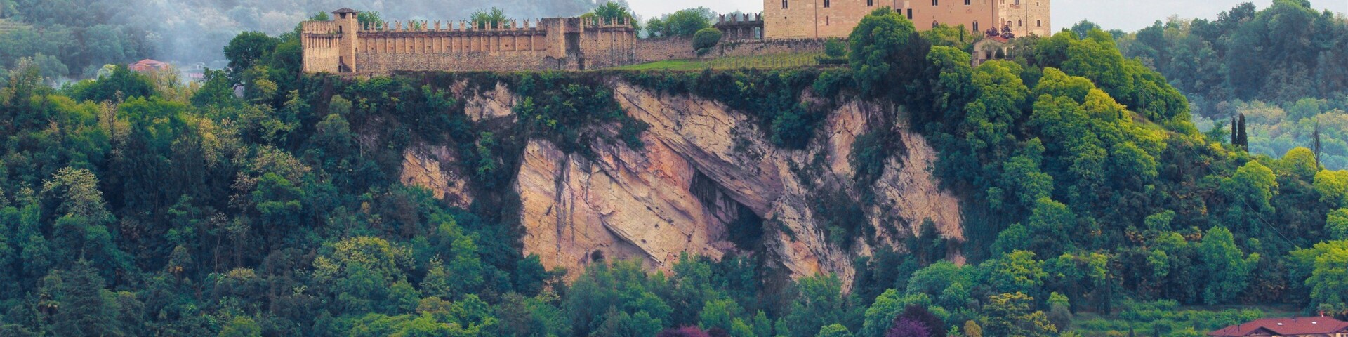 Angera showing a small town or village and a river or creek