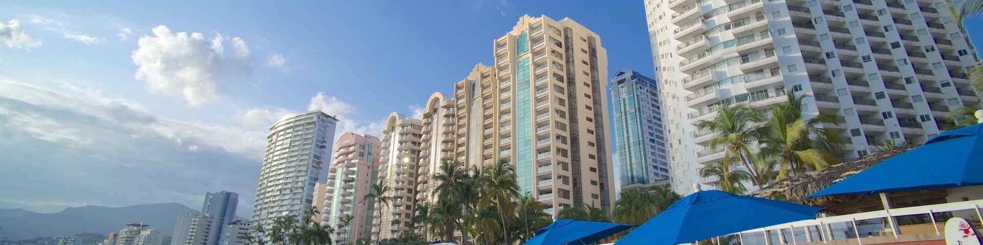 Icacos Beach featuring a sandy beach, a coastal town and a city