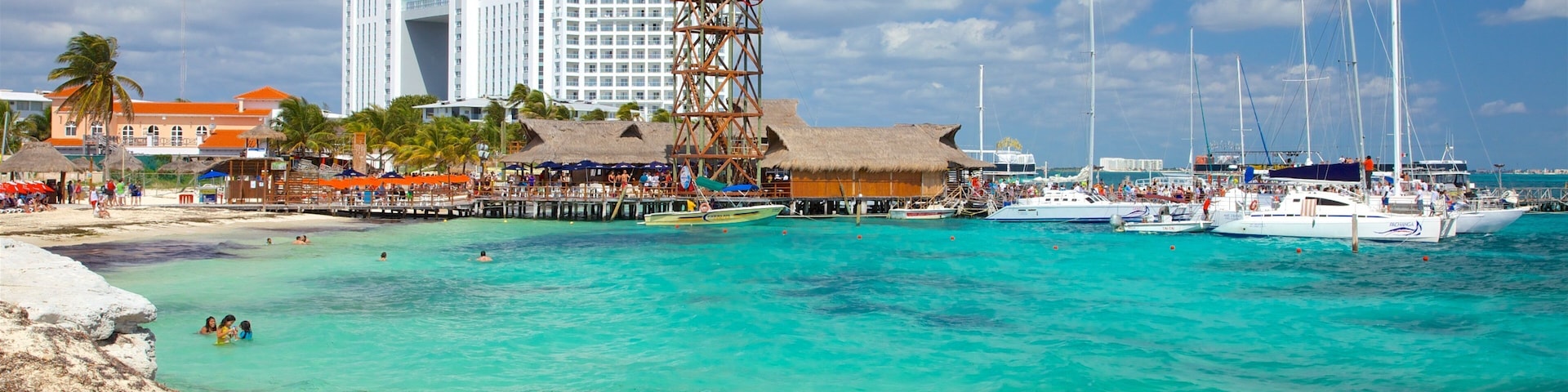 Playa Tortuga which includes swimming, general coastal views and a coastal town