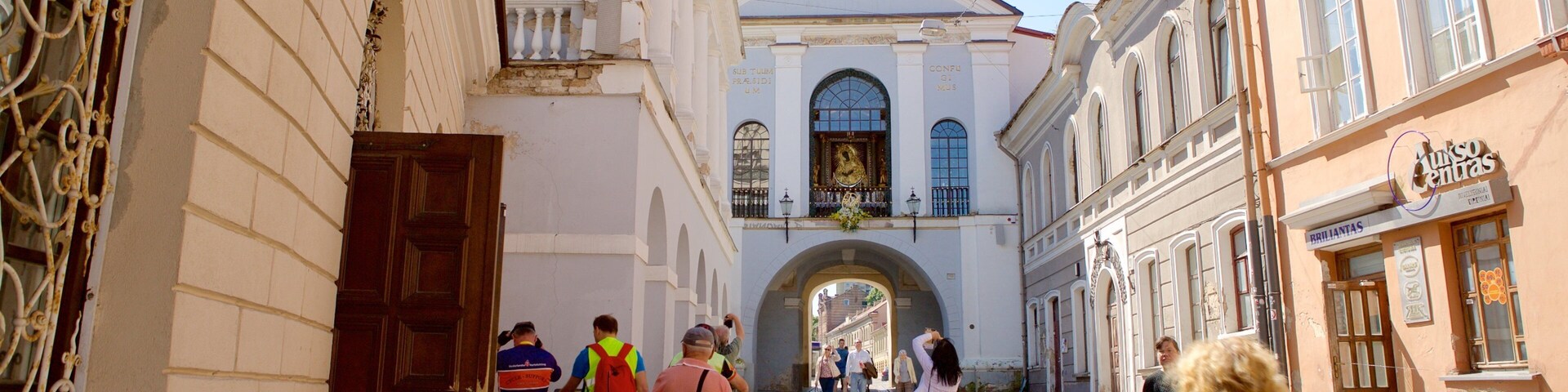 Gate of the Dawn showing a church or cathedral as well as a small group of people