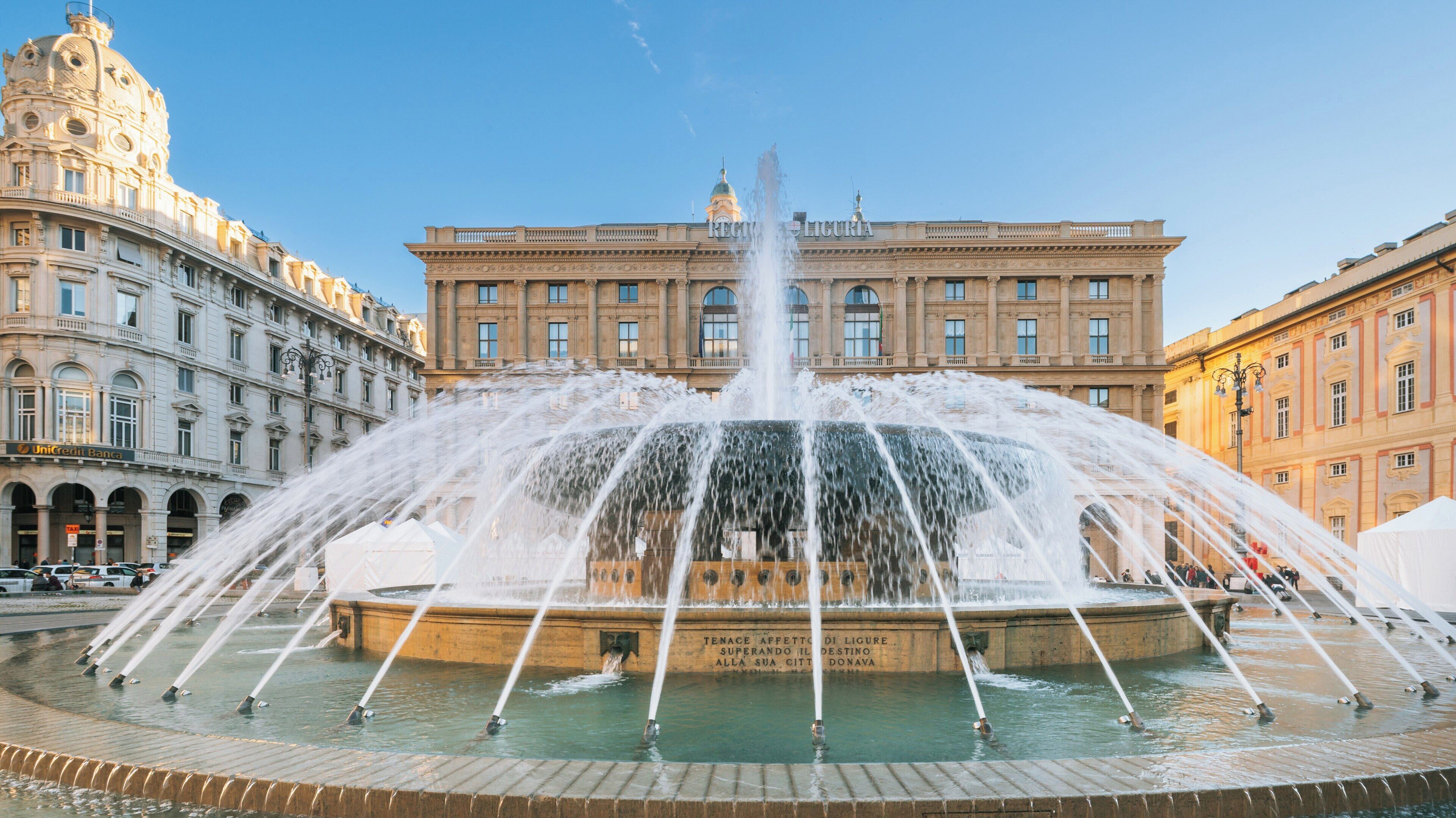 Visit to Piazza de Ferrari in Genoa showcases the stunning fountain and architectural beauty of the historical center during a sunny day