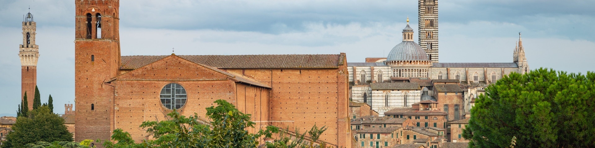 Basilica di San Domenico which includes heritage architecture, landscape views and a city