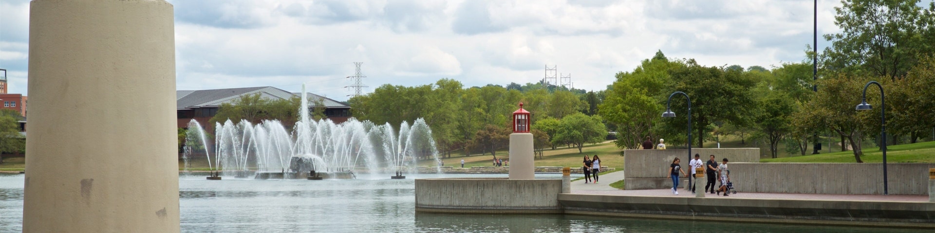Heartland of America Park which includes a fountain and a garden as well as a small group of people