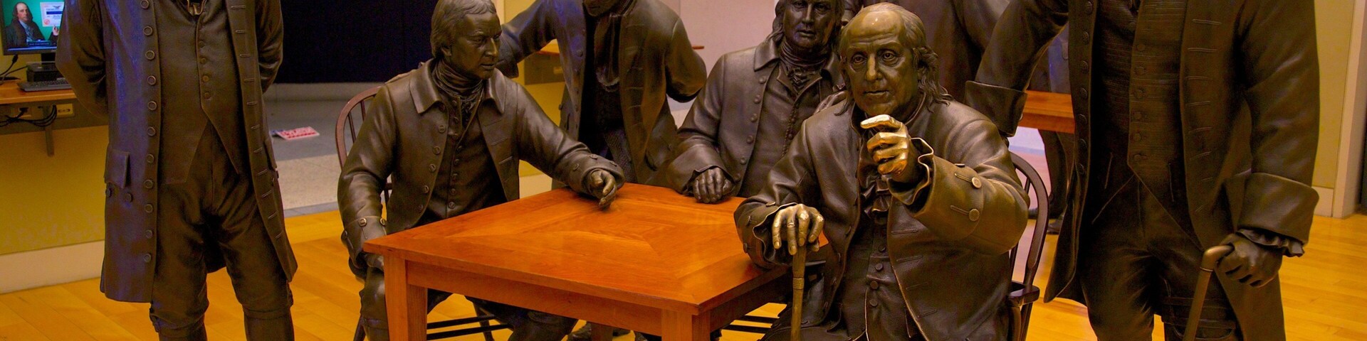 Statues of founding fathers discussing the Constitution at National Constitution Center in Philadelphia