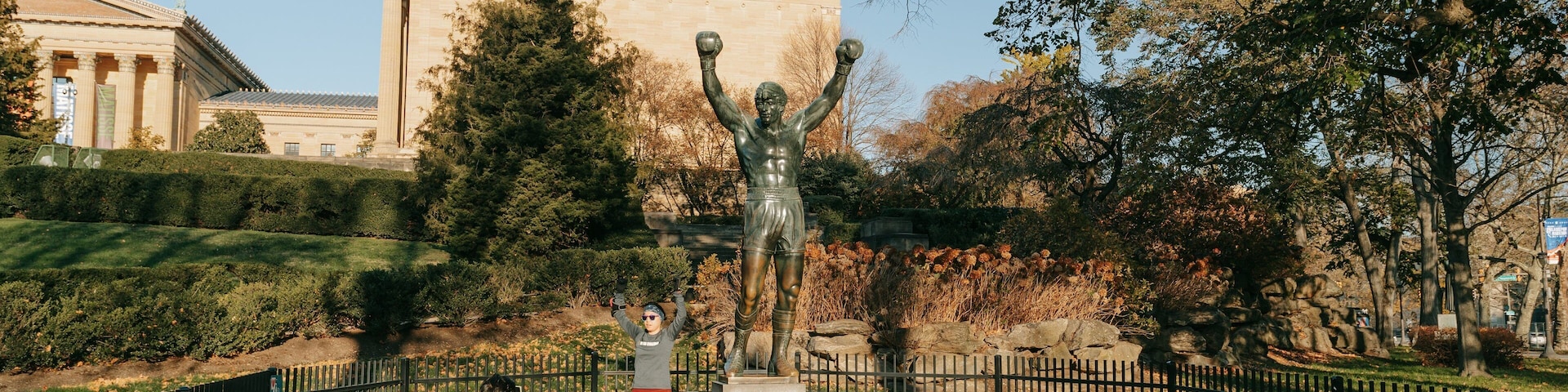 Rocky Statue showing a statue or sculpture as well as a couple