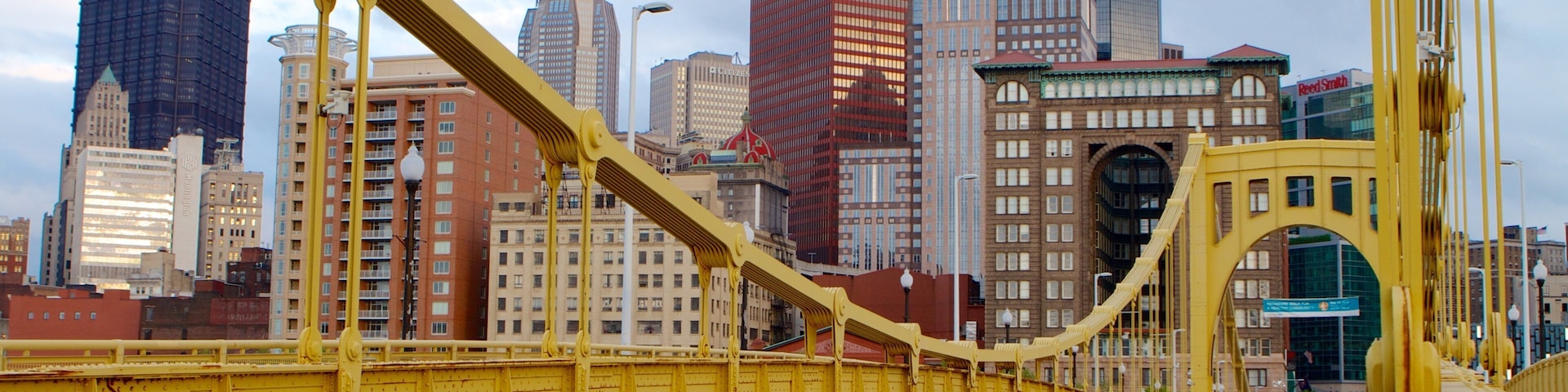 Roberto Clemente Bridge showing a bridge, a city and street scenes