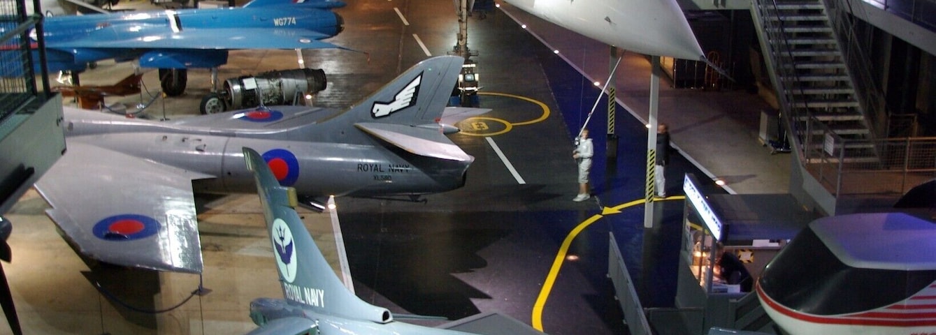 The Fleet Air Arm Museum is devoted to the history of British naval aviation. It has an extensive collection of military and civilian aircraft, aero engines, models of aircraft and Royal Navy ships (especially aircraft carriers), and paintings and drawings related to naval aviation. It is located on RNAS Yeovilton airfield, and the museum has viewing areas where visitors can watch military aircraft (especially helicopters) take off and land. It is located 7 miles (11 km) north of Yeovil, and 40 miles (64 km) south of Bristol.