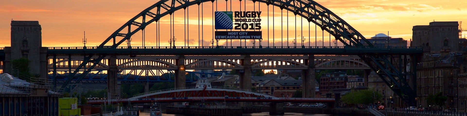 Tyne Bridge showing a city, a river or creek and signage