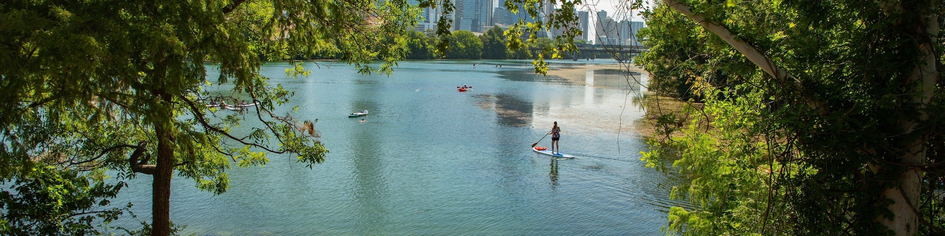 Zilker Park showing a bay or harbor and kayaking or canoeing