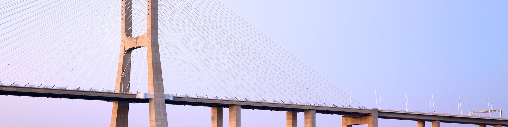 Vasco da Gama Bridge showing a bridge, modern architecture and a river or creek