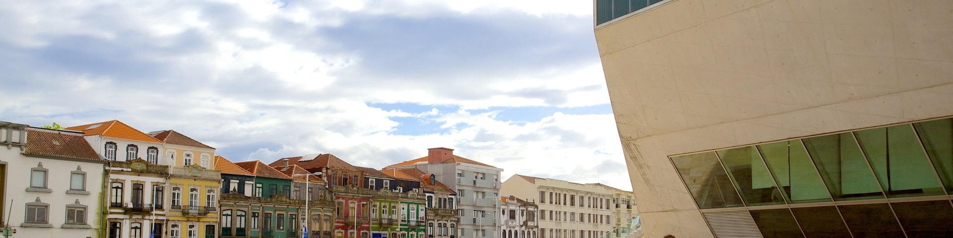 Casa da Musica which includes a square or plaza as well as a small group of people