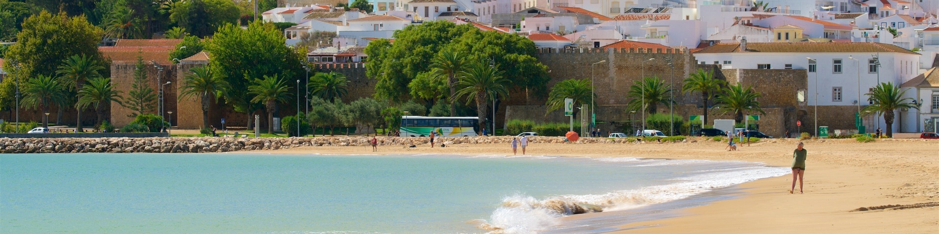 Meia Praia Beach which includes a sandy beach, a coastal town and general coastal views