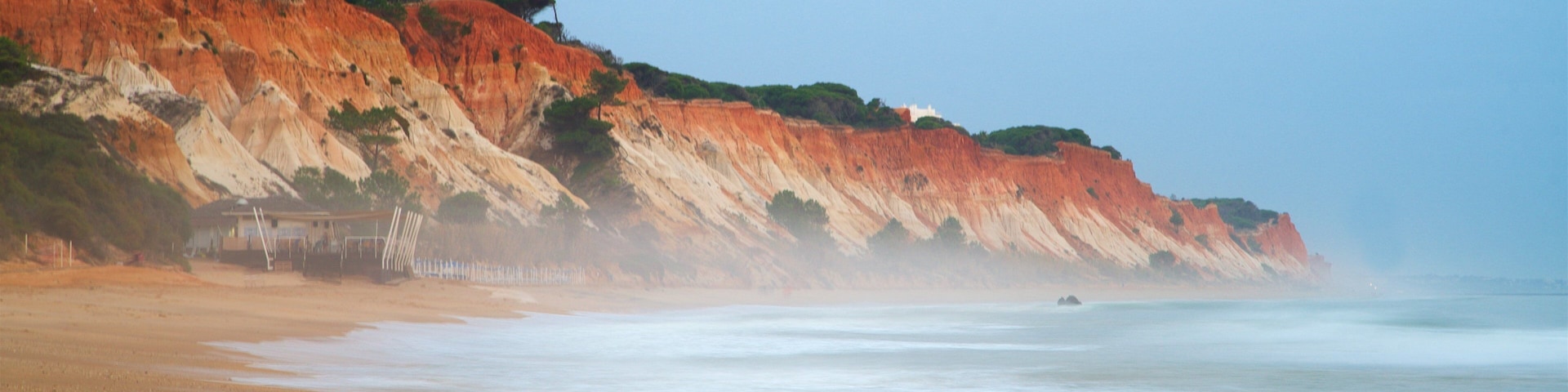 Falesia Beach featuring rocky coastline, general coastal views and a sandy beach