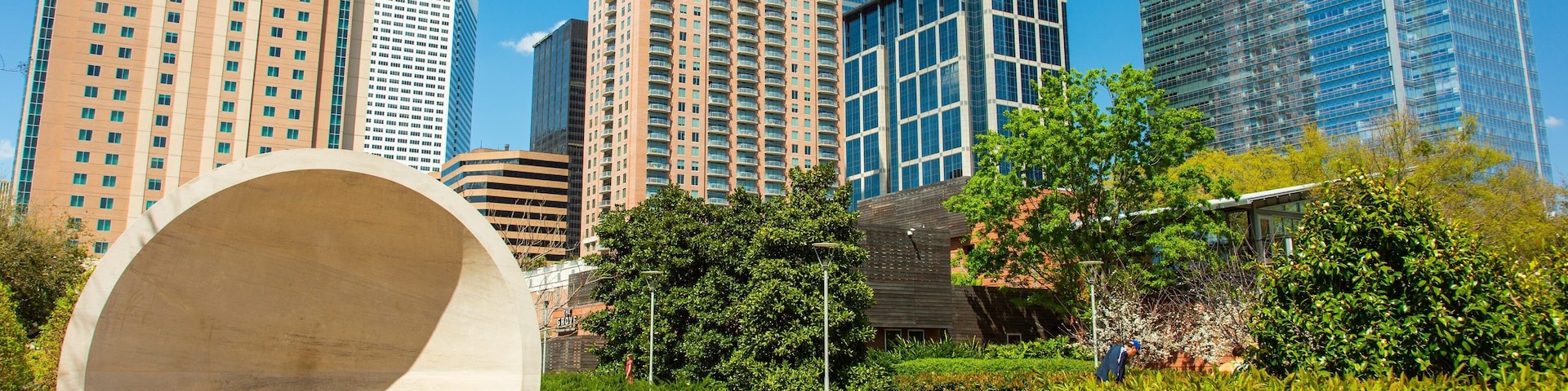 Discovery Green featuring a garden, a city and a skyscraper