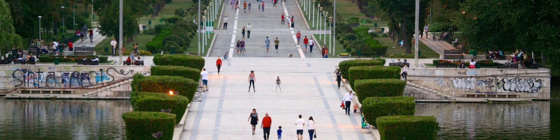 Carol Park which includes a garden, a river or creek and a square or plaza