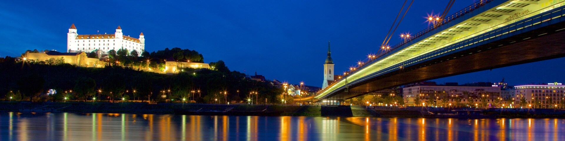New Bridge showing night scenes, a bridge and a river or creek