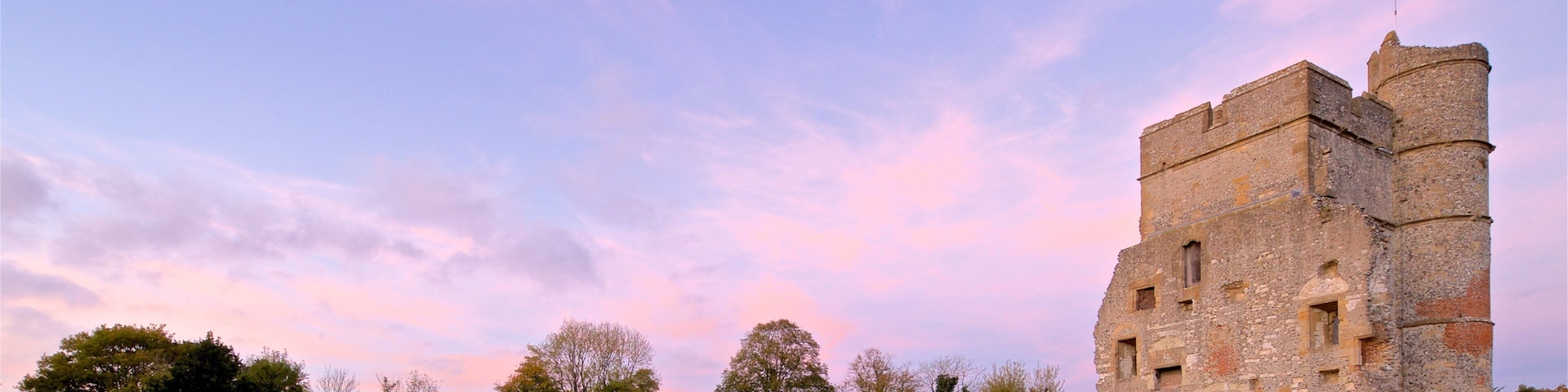 Donnington Castle featuring building ruins, a sunset and landscape views