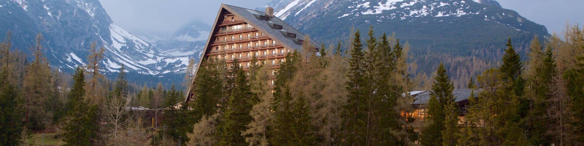 Strbske Pleso which includes a lake or waterhole, a house and forests