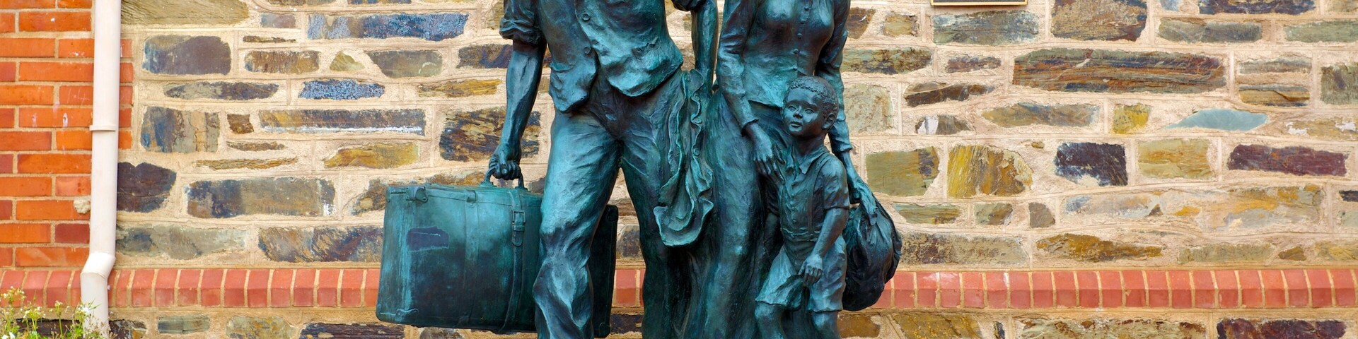 Migration Museum featuring signage and a statue or sculpture