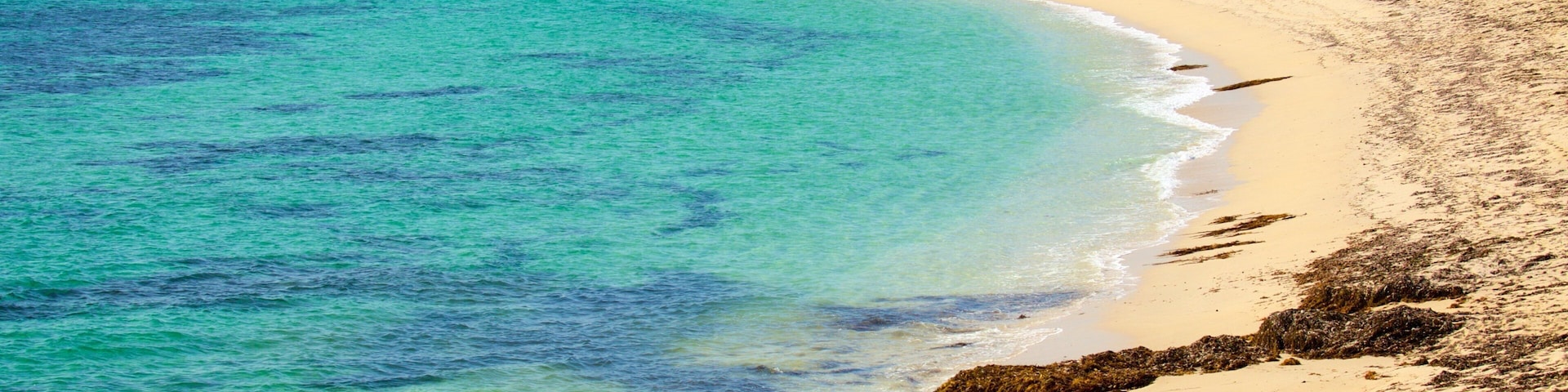 Prevelly Beach showing a bay or harbor, a beach and general coastal views