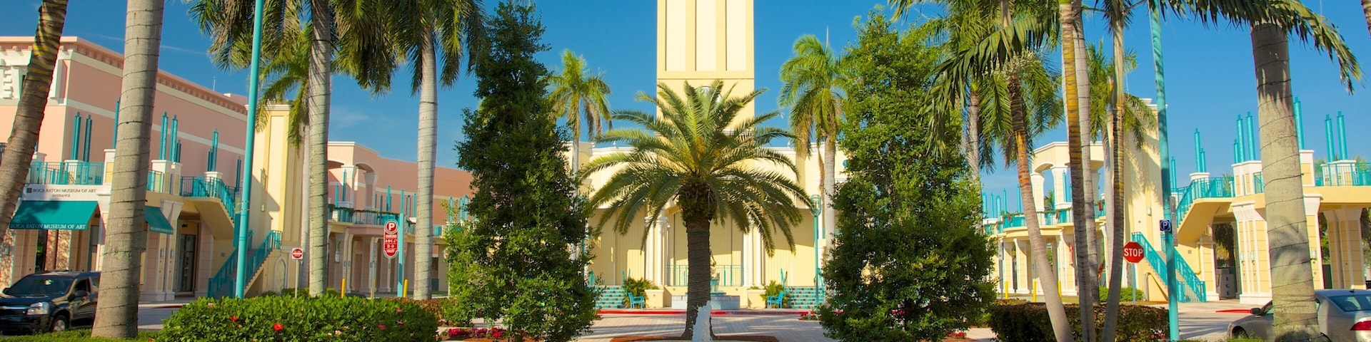 Mizner Park in Boca Raton showcases vibrant landscaping and beautiful architecture under a clear blue sky