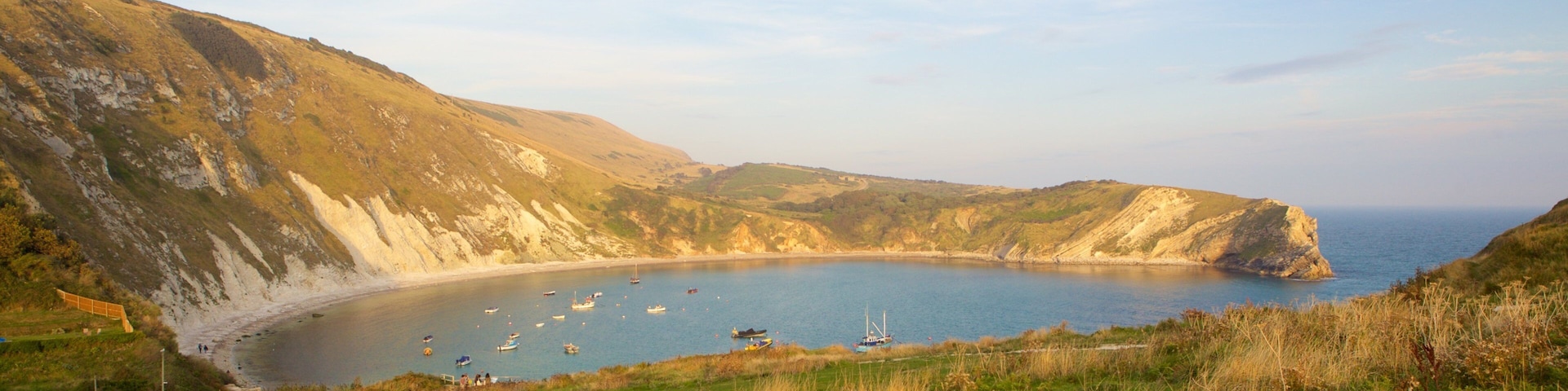 Lulworth Cove Beach which includes general coastal views, tranquil scenes and a bay or harbor