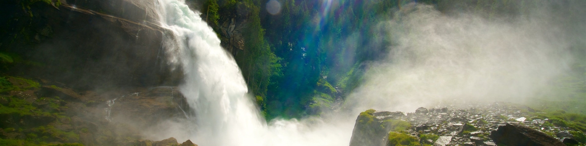 Krimmler Waterfalls which includes a cascade, forests and a river or creek