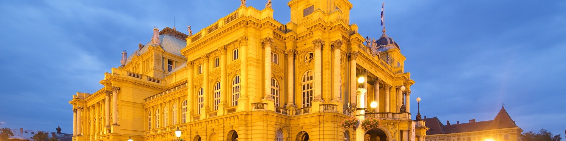 Croatian National Theatre which includes night scenes, heritage architecture and theater scenes