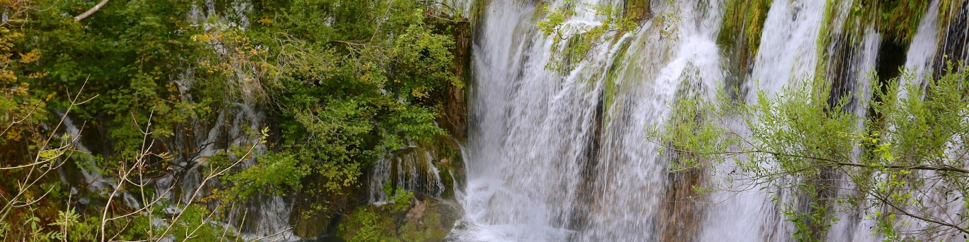 Plitvice Lakes National Park - Entrance 1 featuring a cascade and a lake or waterhole