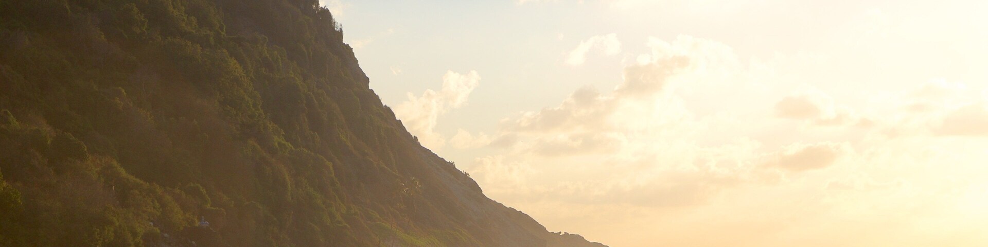 Conceicao Beach which includes general coastal views, a sandy beach and a sunset