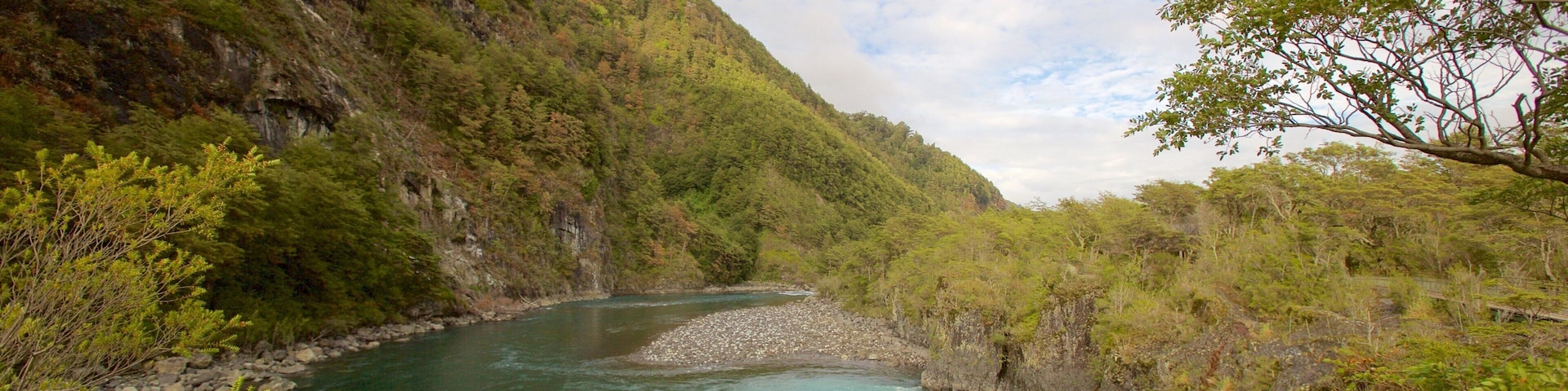Petrohue Falls featuring mountains and a river or creek