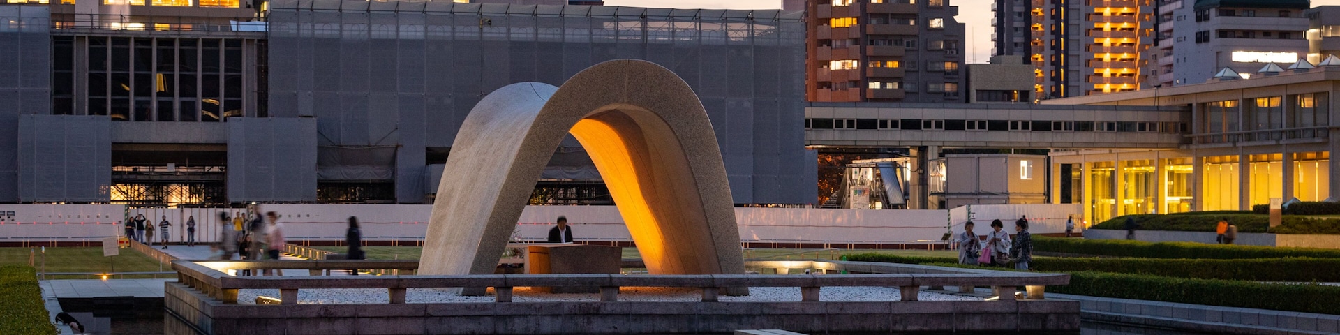 Hiroshima Peace Memorial Park featuring a sunset and a pond