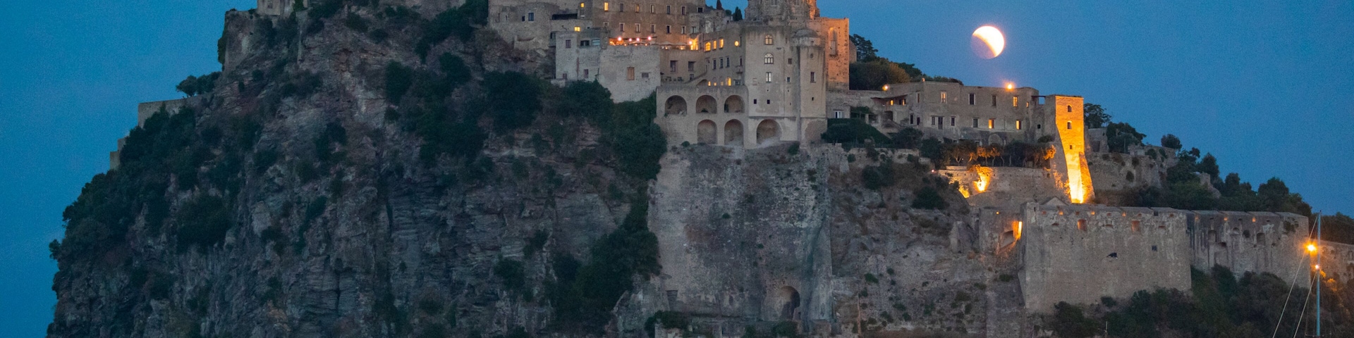 Aragonese Castle which includes general coastal views, night scenes and heritage elements