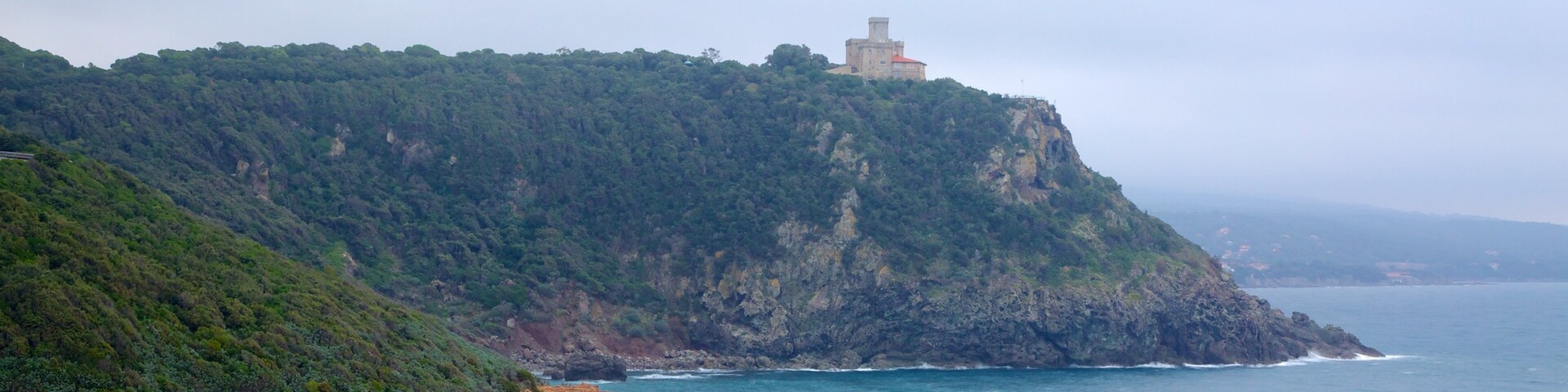Castello Sonnino which includes general coastal views, mist or fog and rugged coastline
