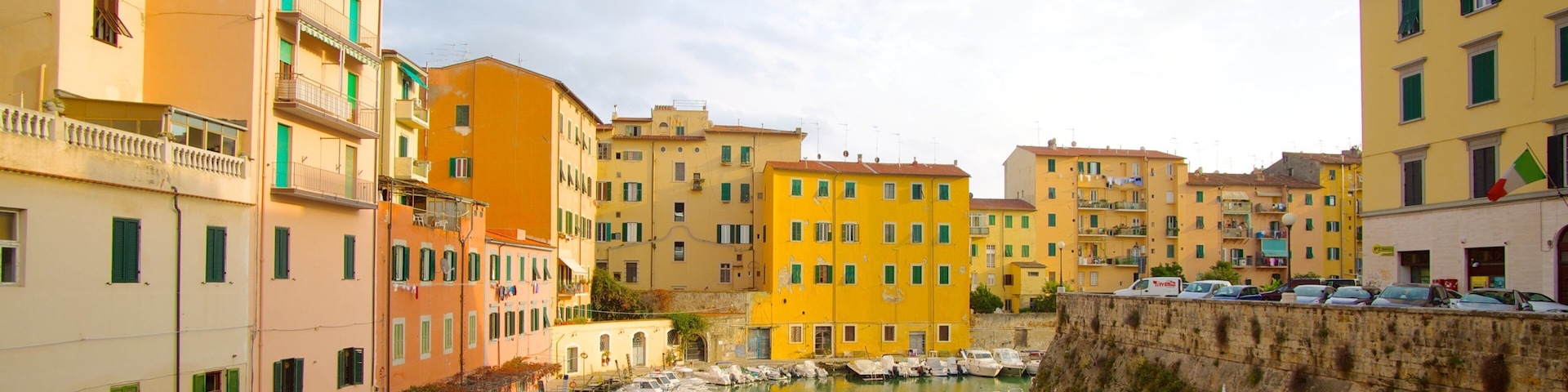 Piazza della Repubblica which includes a river or creek, a city and boating