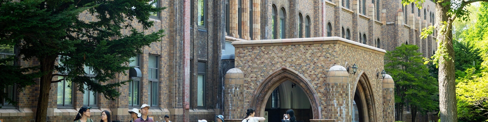 Hokkaido University featuring street scenes and heritage elements as well as a small group of people