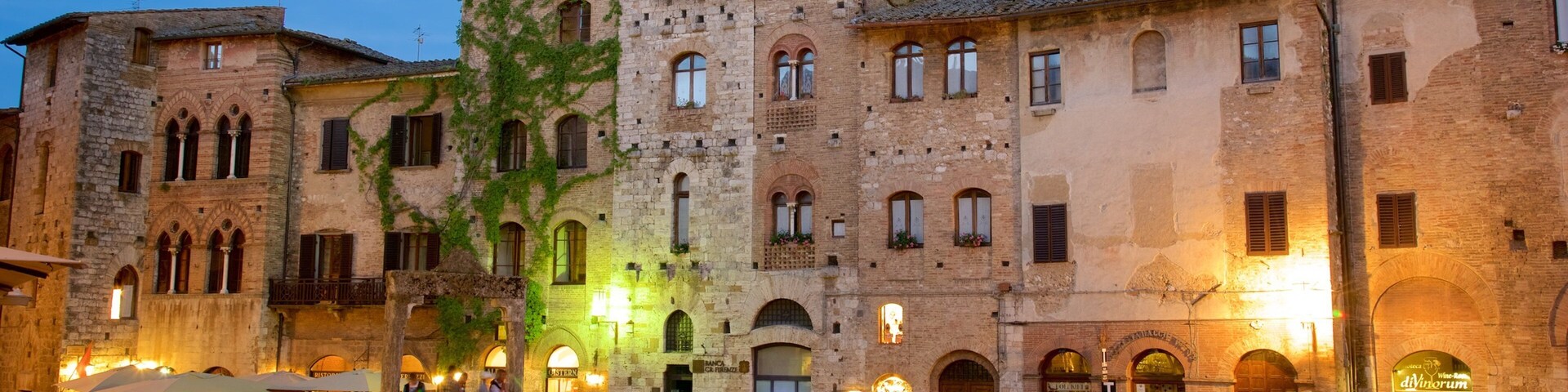 Piazza della Cisterna showing heritage architecture, a square or plaza and night scenes