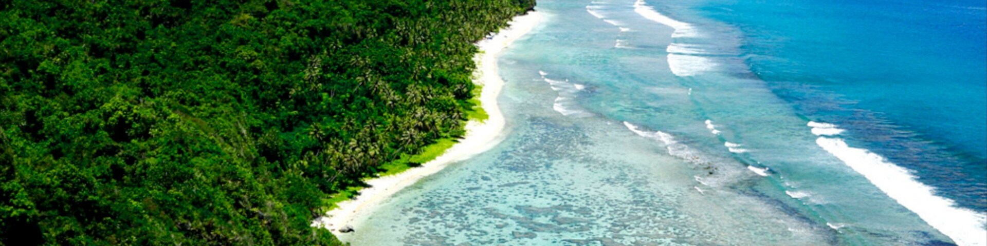 Tumon Beach featuring landscape views, a coastal town and a beach