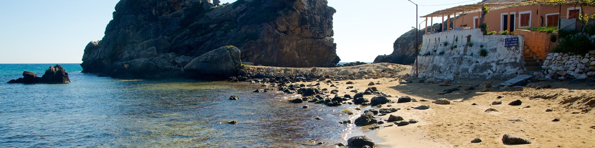 Pelekas Beach showing a coastal town, landscape views and a beach