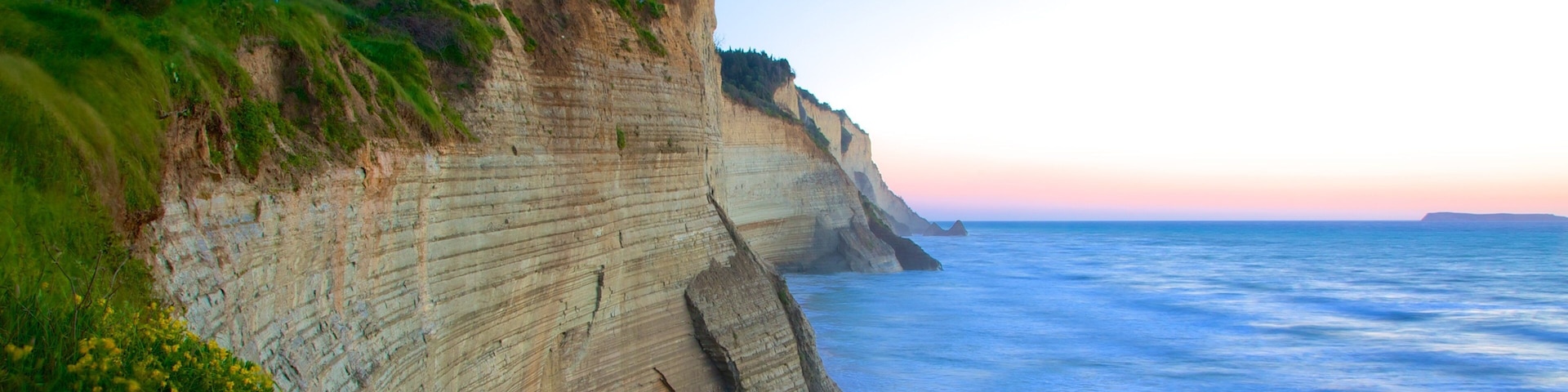 Sunset Beach showing rugged coastline and a sunset